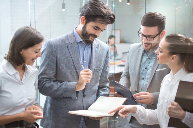 Group of Business People Discussing Document on a Meeting in the Modern ...