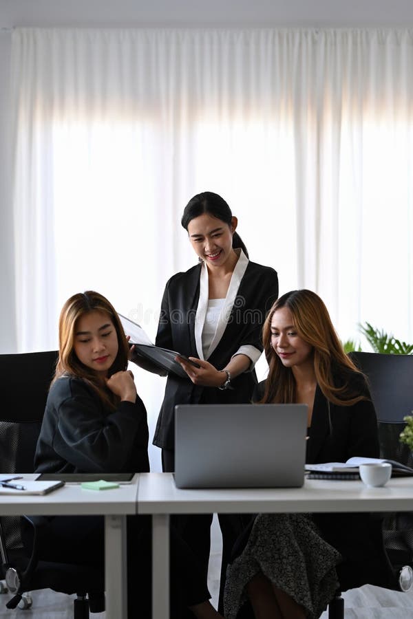 Business People Discussing Financial Data Report Together in Office ...