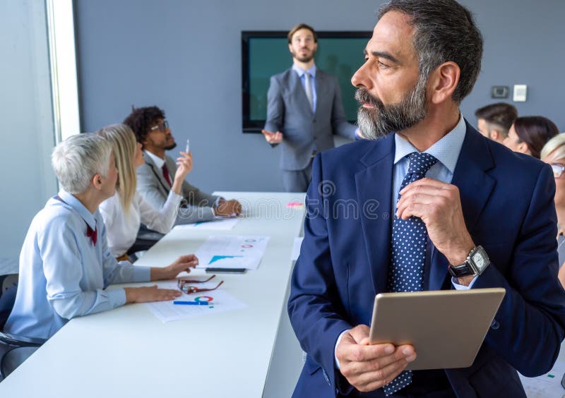 Group of Business People Discussing Project in the Office. Meeting ...