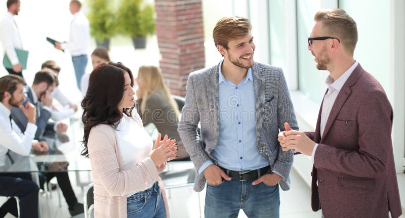 Group of Business People Discussing Something Standing in the of Stock ...