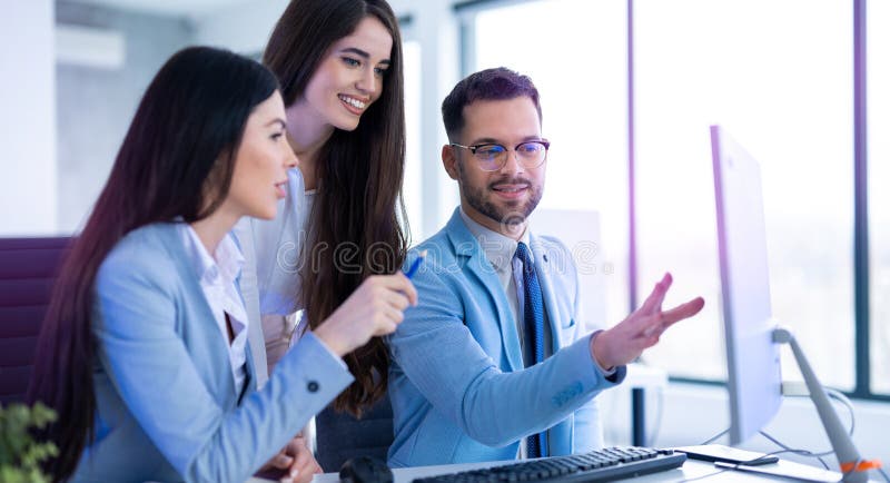 Group of Business People Engaging in Collaborative Process of Analyzing ...