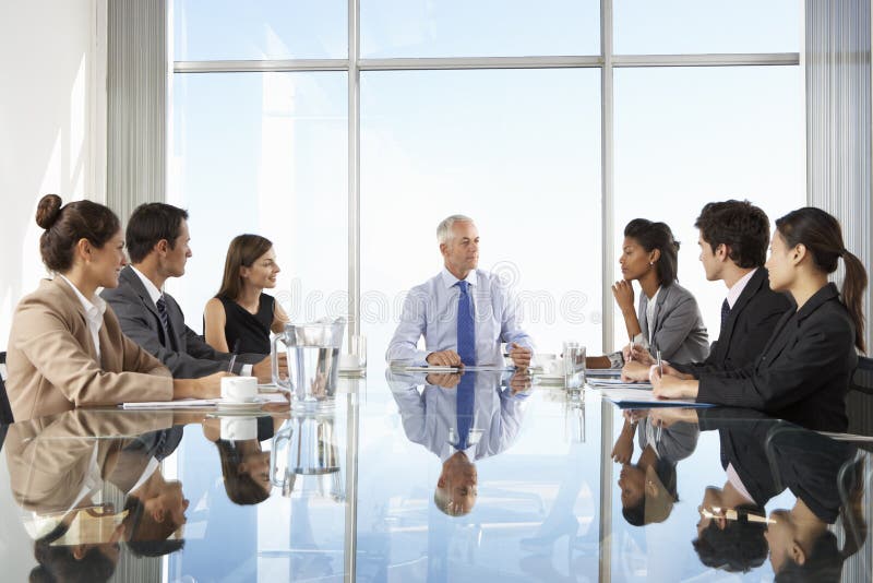 Group of Business People Having Board Meeting Around Glass Table Stock ...