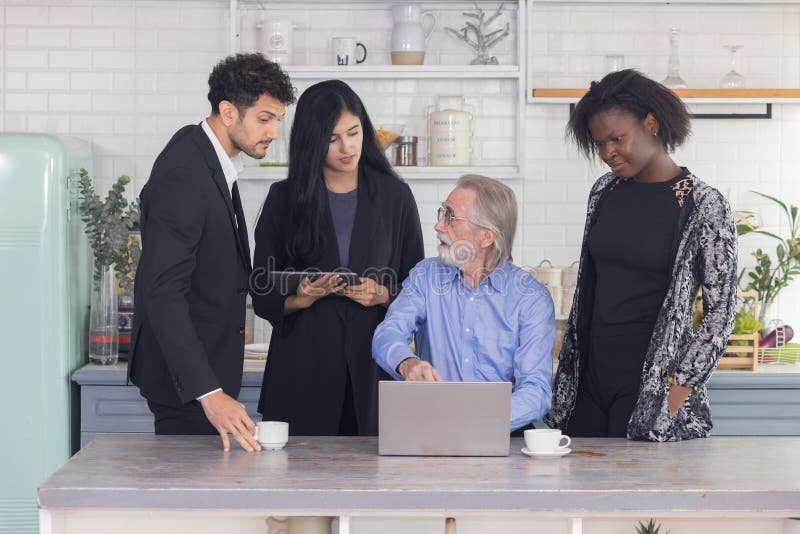 Group of Business People Having a Discussion in an Office Pantry Stock ...