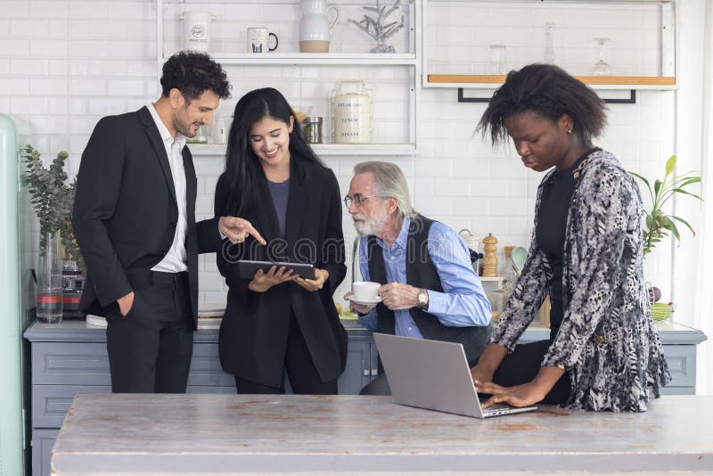 Group of Business People Having a Discussion in an Office Pantry Stock ...
