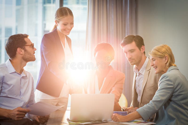 Group of Business People Interacting Using Laptop Stock Image - Image ... Group of Business People Interacting Using Laptop Stock Image - Image ...
