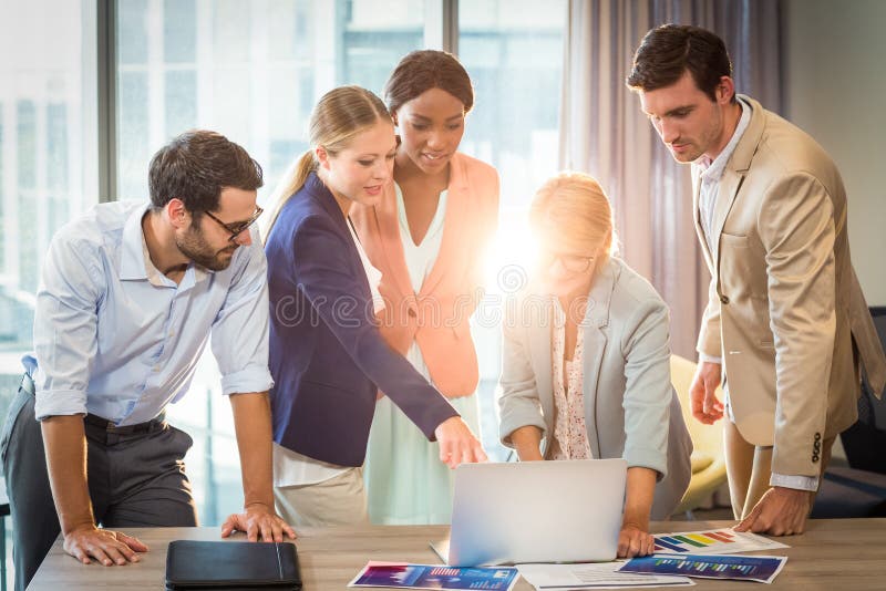 Group of Business People Interacting Using Laptop Stock Image - Image ...