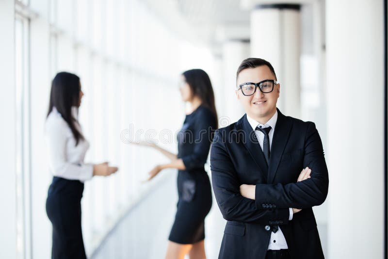 Group of Business People with Leader at Front in Office Stock Photo ...