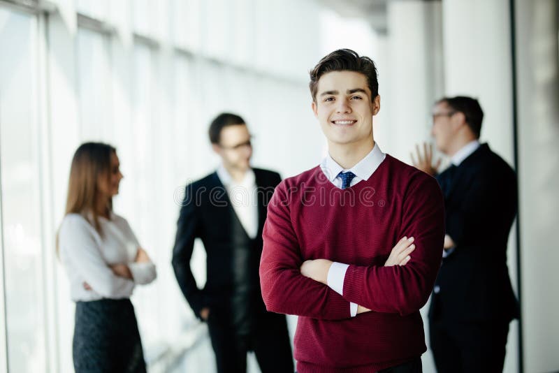 Group of Business People with Leader at Front in Office Hall Stock ...
