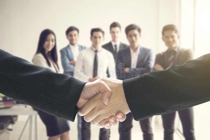 Group of Business People Making Handshake Agreement. Stock Photo ...