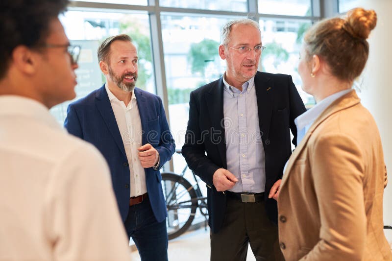 Group of Business People Making Small Talk during a Break Stock Image ...