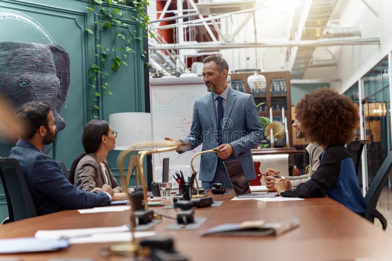 A Group of Business People Partners during a Set Team Meeting in the ...