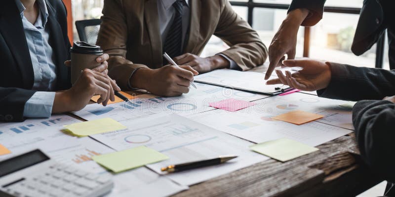 Group of Business People and Partnership Analyze the Marketing Plan ...