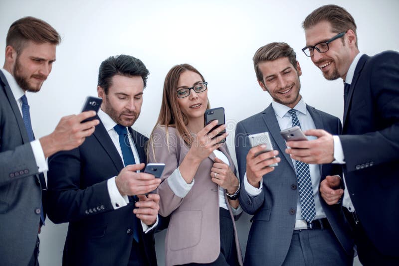 Group of Business People Reading a Message on Phones Stock Photo ...