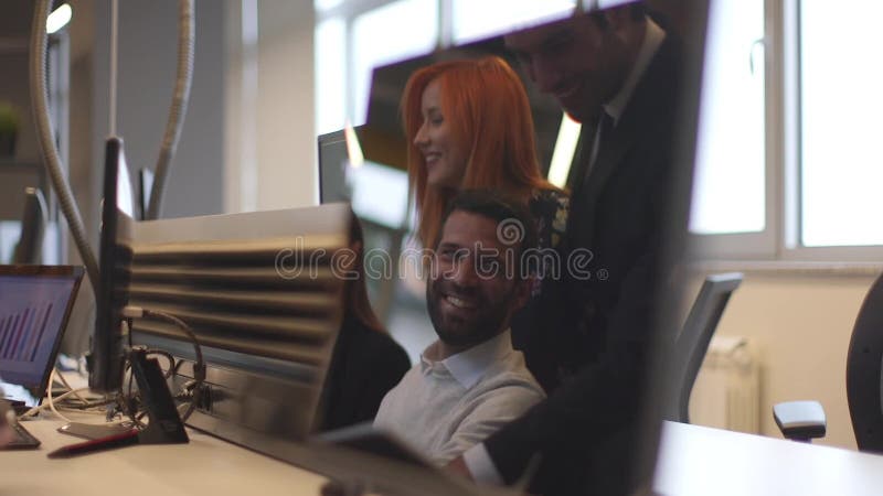 Group of Business People in the Reflection of Computer Screen at Office ...