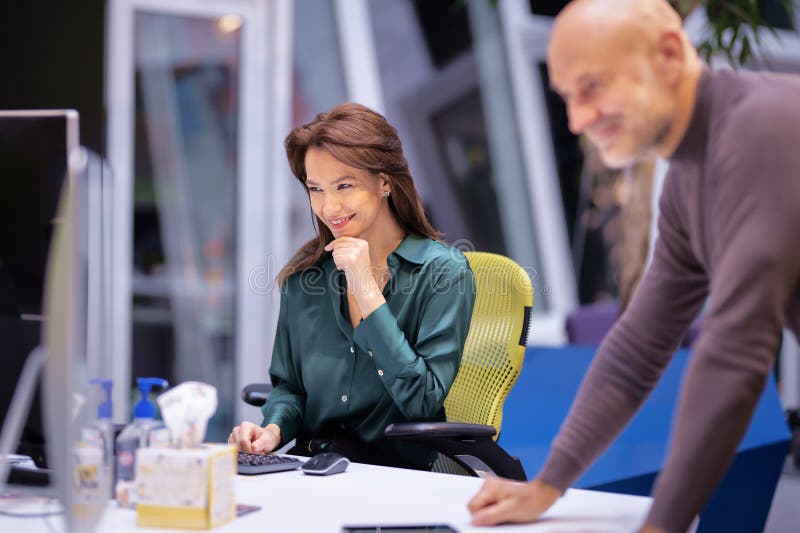 Group of Business People Sitting and Standing at Office Desk Surrounded ...