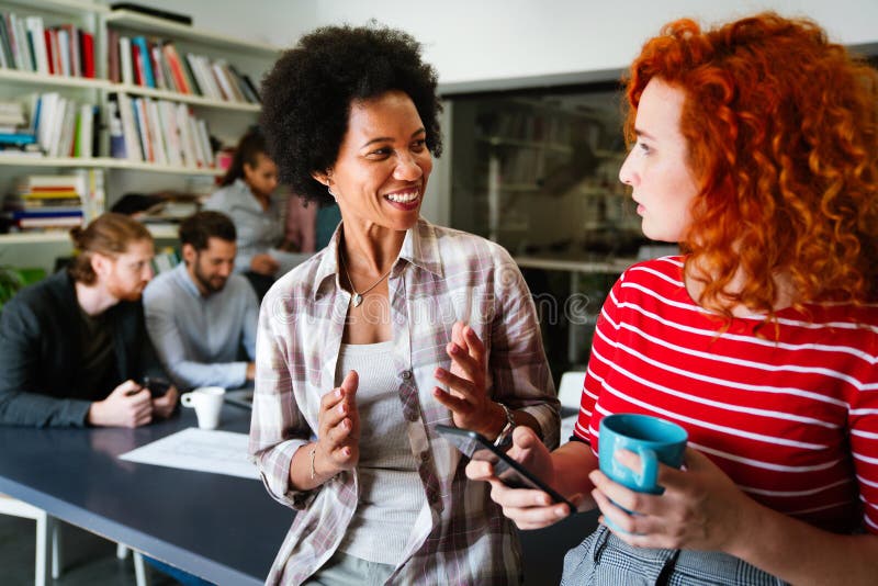 Group of Business People and Software Developers Working As a Team in ...