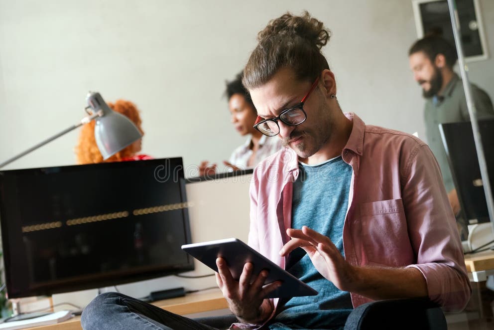 Group of Business People and Software Developers Working As a Team in ...