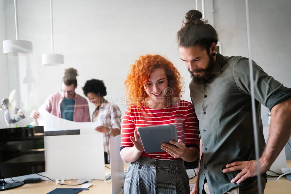 Group of Business People and Software Developers Working As a Team in ...