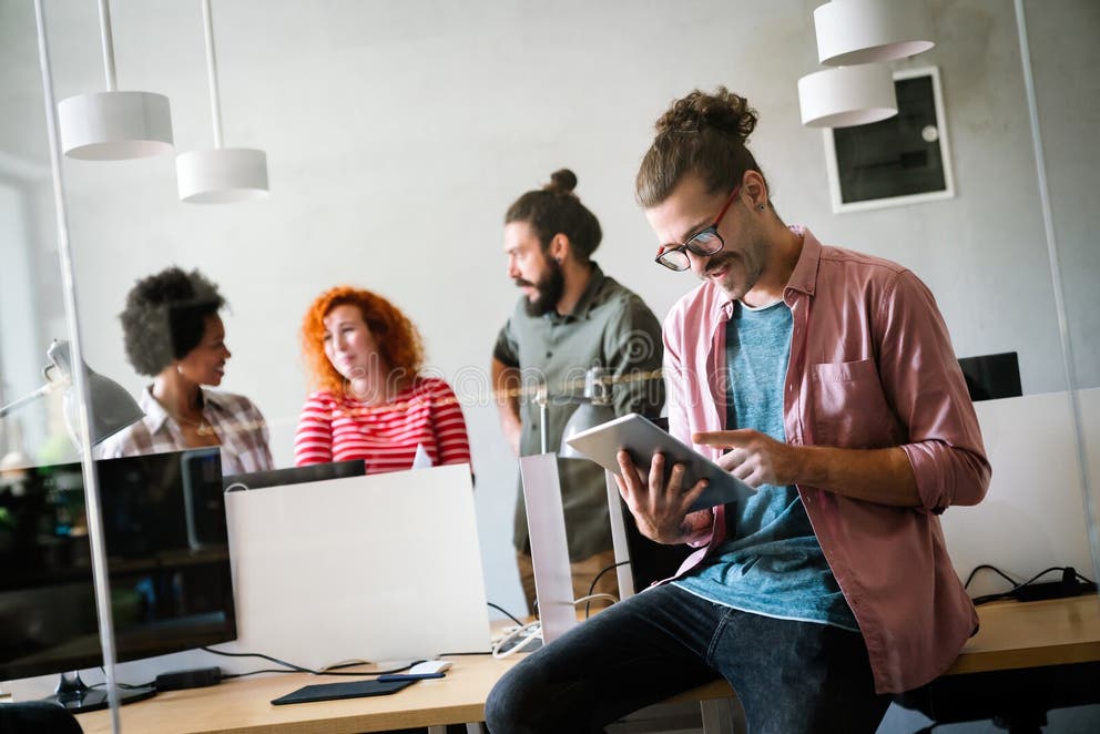 Group of Business People and Software Developers Working As a Team in ...