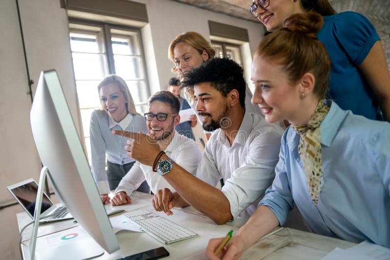 Group of Business People and Software Developers Working As a Team in ... Group of Business People and Software Developers Working As a Team in ...