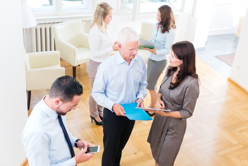 Group of Business People Standing in Office Stock Photo - Image of ...