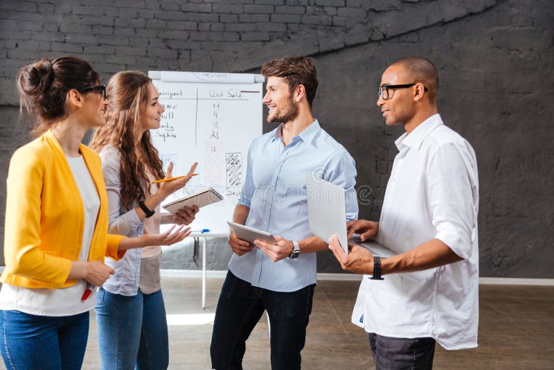 Group of Business People Standing and Talking in Conference Room Stock ...