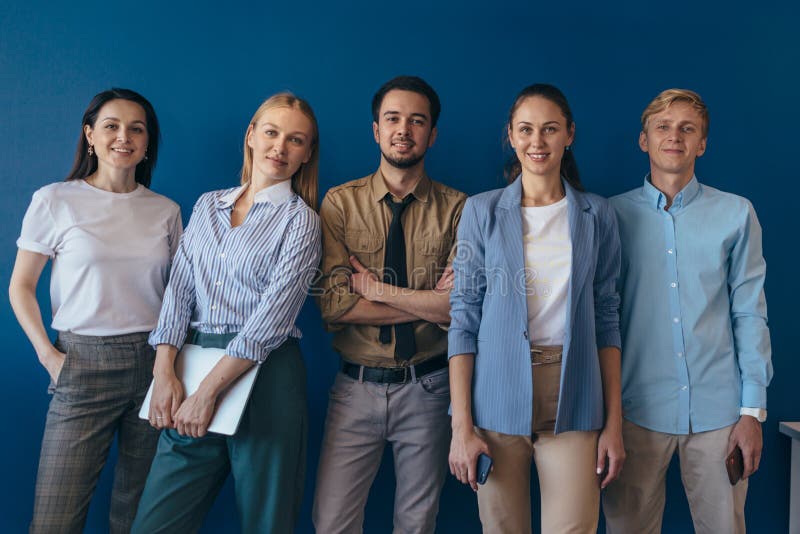 Group of Business People Standing Together in Office. Stock Photo ...