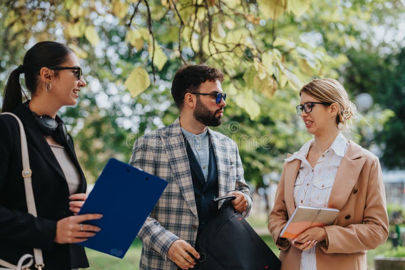 Group of Business People Talking Outdoors Under Trees Stock Photo ...