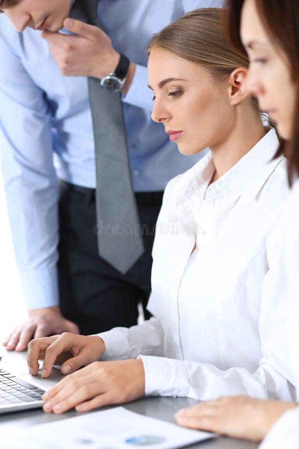 Group of Business People Using Laptop Computer in Office. Meeting and ...