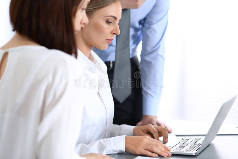 Group of Business People Using Laptop Computer in Office. Meeting and ...