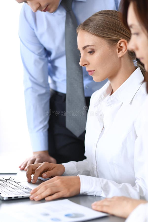 Group of Business People Using Laptop Computer in Office. Meeting and ...
