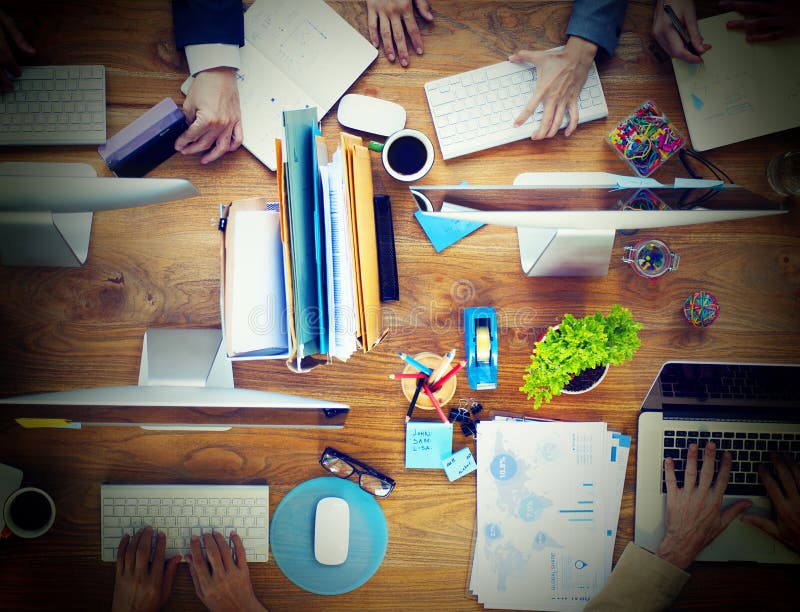Group of Business People Working on an Office Desk Concept Stock Image ...