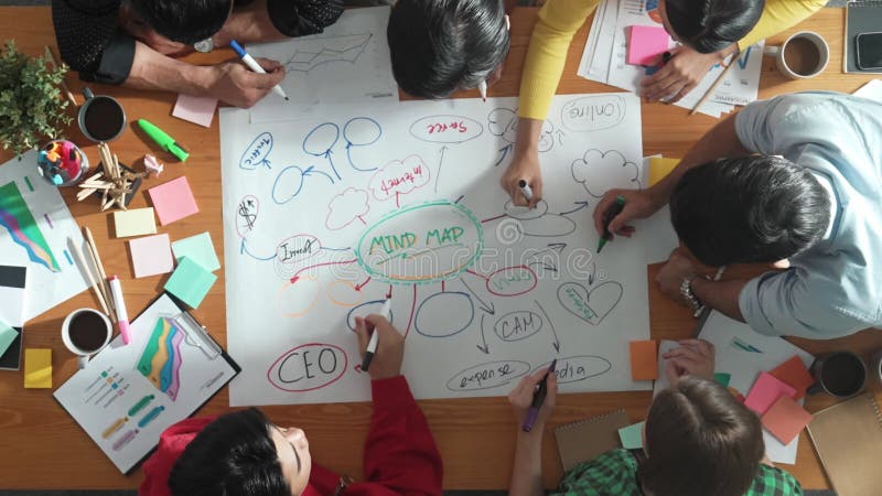 Group of Business People Writing and Making Mind Map at Meeting ...