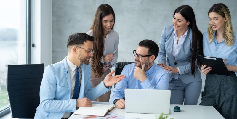 Group of Business Professionals Having a Meeting in Office with Their ...