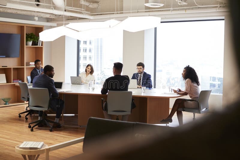 Group of Business Professionals Meeting Around Table in Modern Office ...