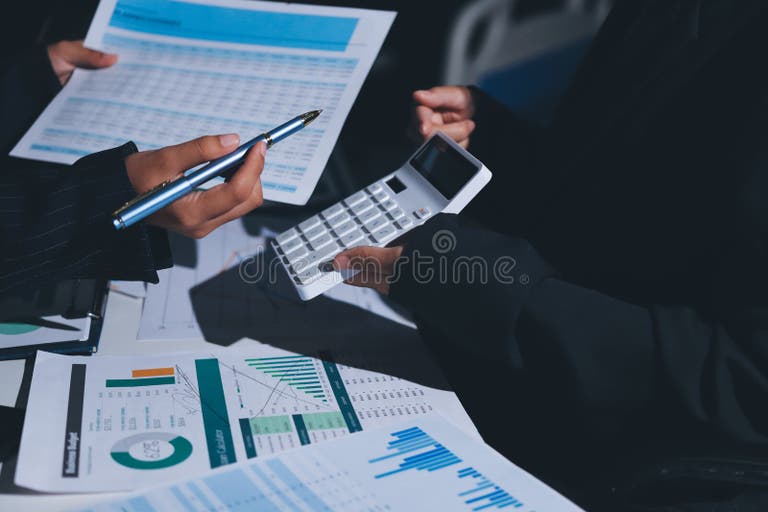 Group of Business Women Working on a Financial Data Expenses Document ...