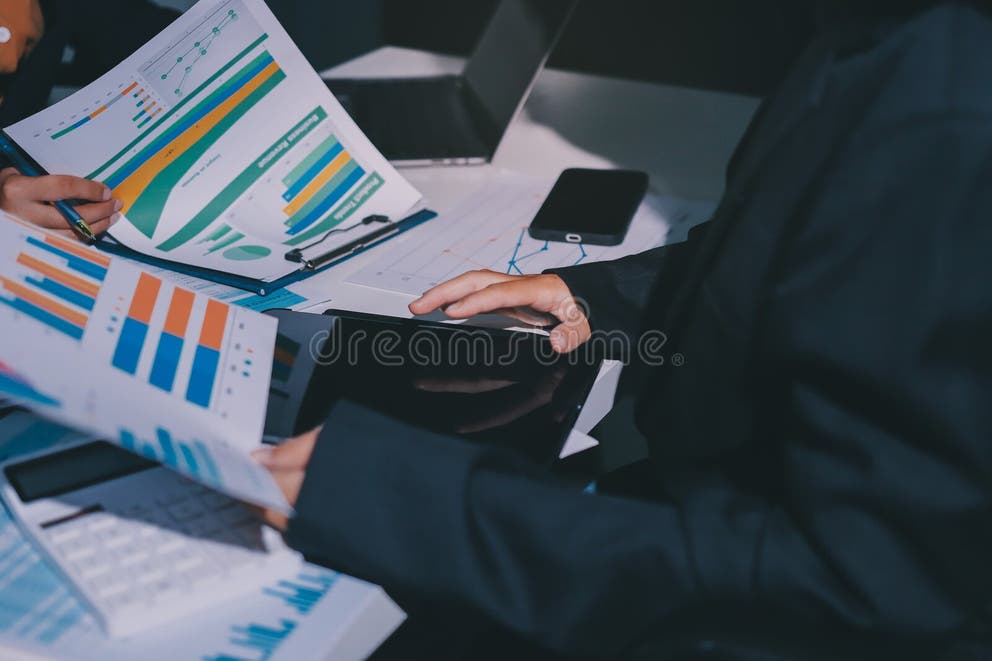 Group of Business Women Working on a Financial Data Expenses Document ...