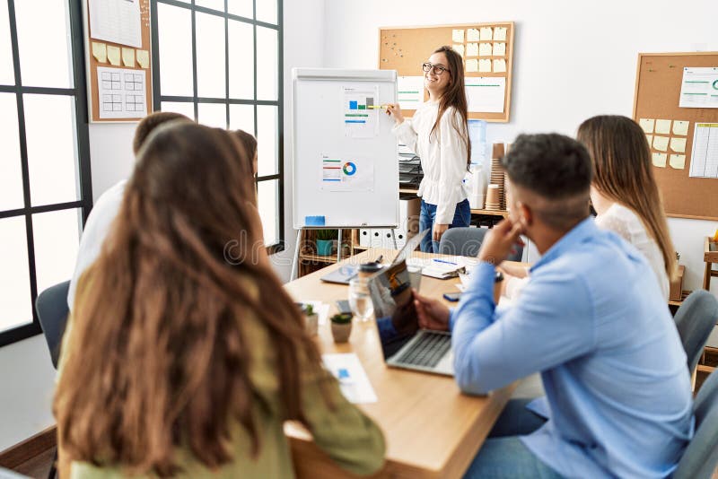 Group of Business Workers on Chart Board Presentation at the Office ...