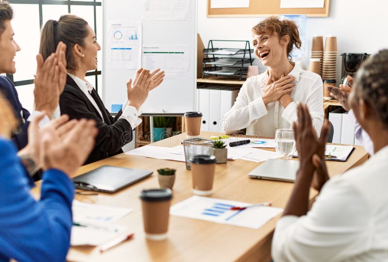 Group of Business Workers Smiling and Clapping To Partner at the Office ...