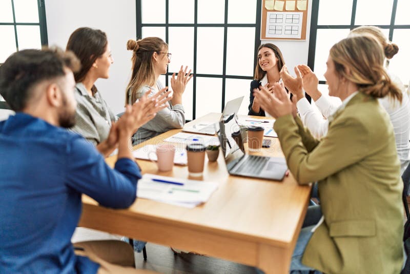 Group of Business Workers Smiling and Clapping To Partner at the Office ...