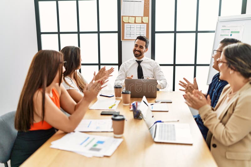 Group of Business Workers Smiling and Clapping To Partner at the Office ...