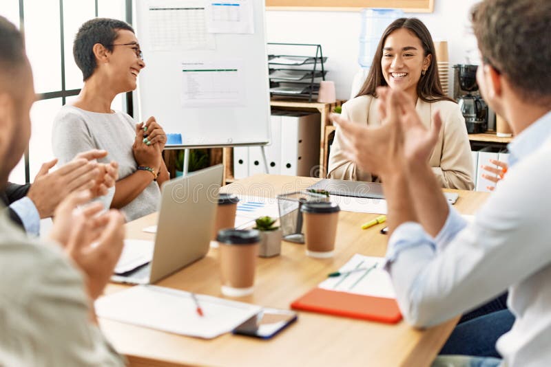 Group of Business Workers Smiling and Clapping To Partner at the Office ...