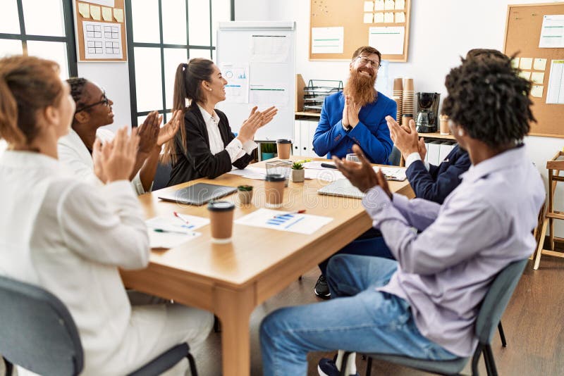 Group of Business Workers Smiling and Clapping To Partner at the Office ...