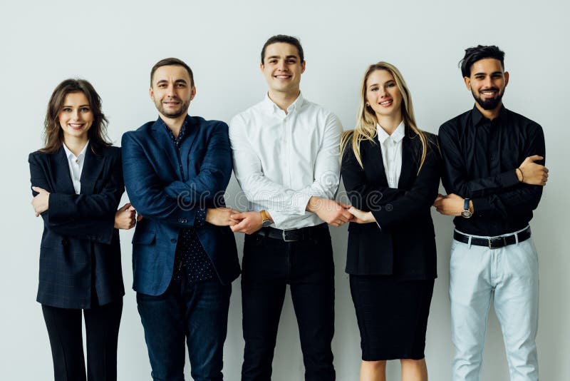 Group of Business Workers Standing Together Shakinghands at the Office ...