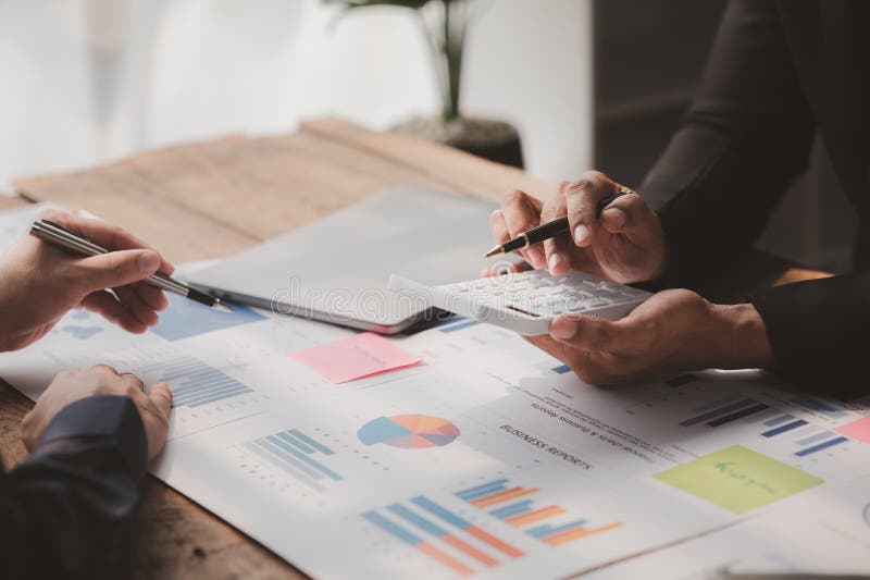 Group Businessmen Point To the Material for the Meeting, Working ...
