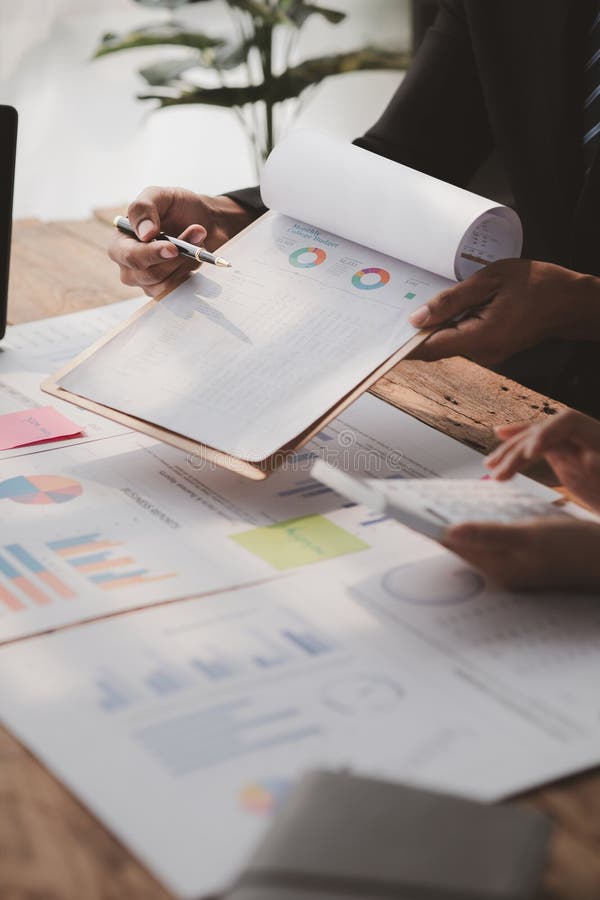 Group Businessmen Point To the Material for the Meeting, Working ...