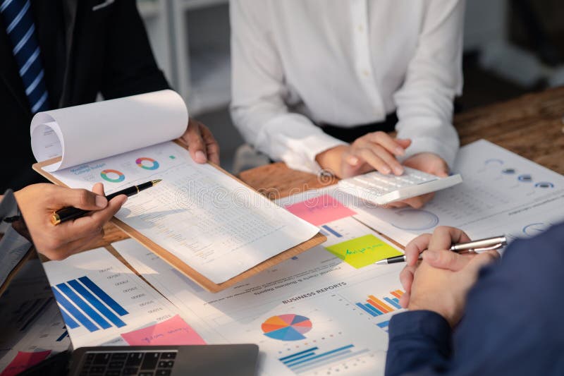 Group Businessmen Point To the Material for the Meeting, Working ...
