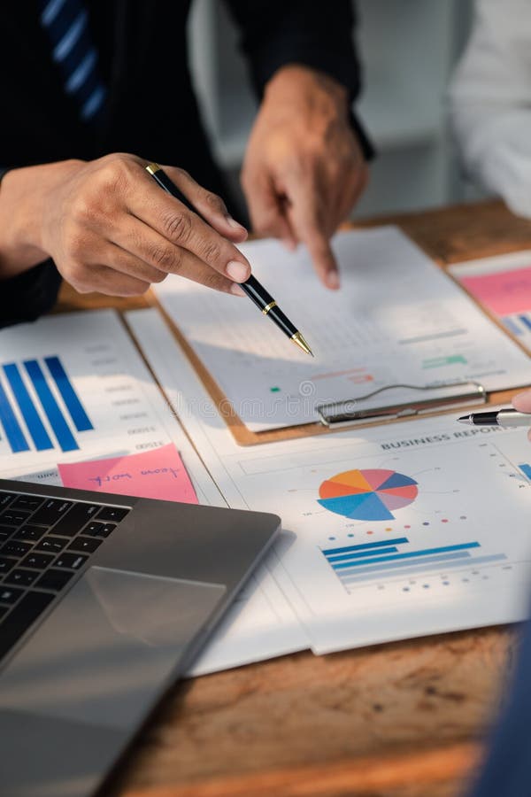 Group Businessmen Point To the Material for the Meeting, Working ...