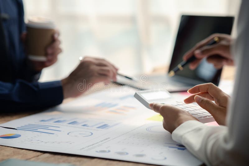 Group Businessmen Point To the Material for the Meeting, Working ...