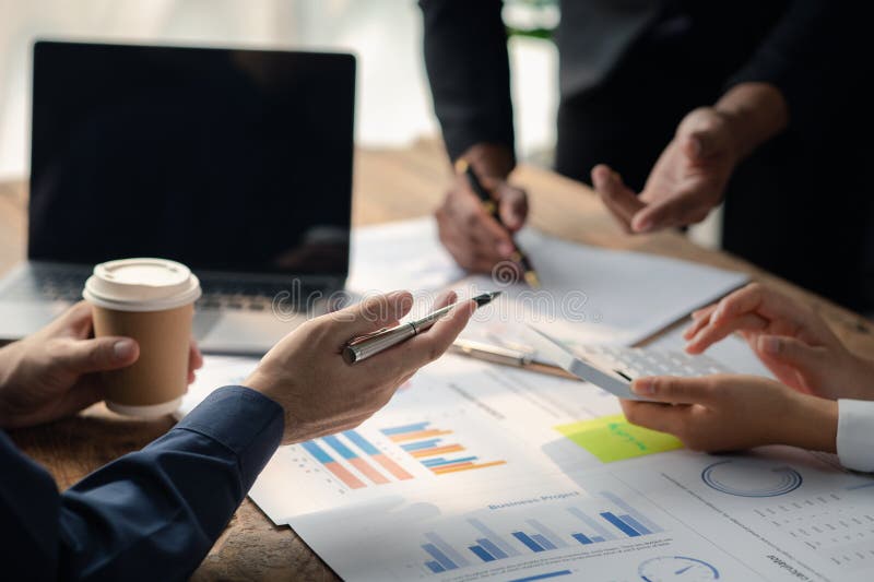 Group Businessmen Point To the Material for the Meeting, Working ...